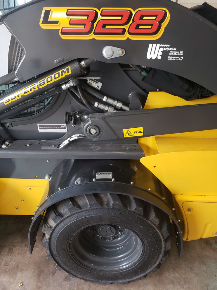 New Holland Fenders | D-Fender | De Forest, WI | Custom Fenders for Skid Loaders